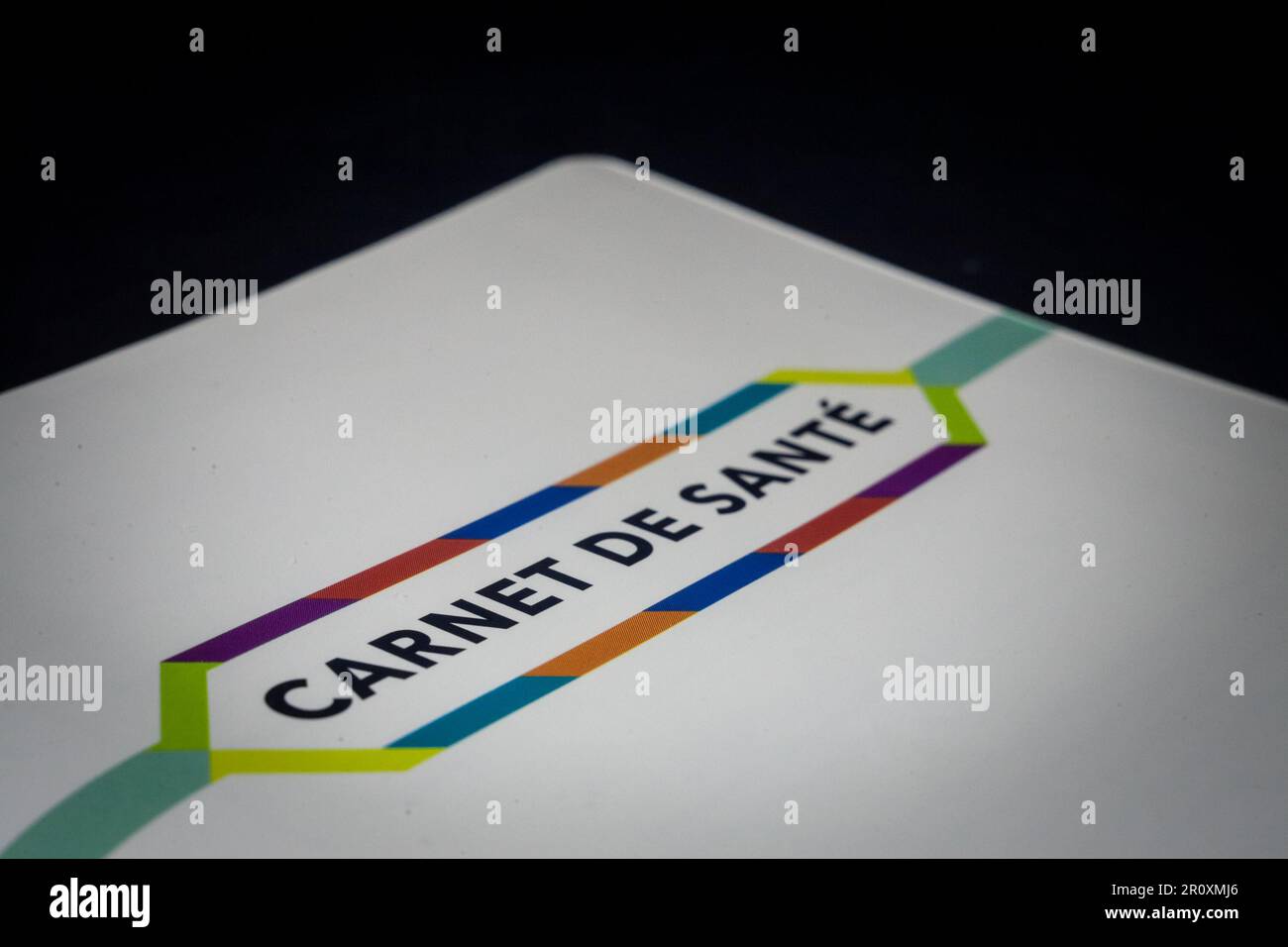 Picture of a french carnet de sante isolated on a black background ...