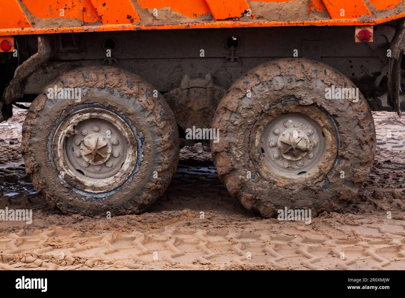 Dirty truck wheels on yellow sand. close-up photo Stock Photo - Alamy