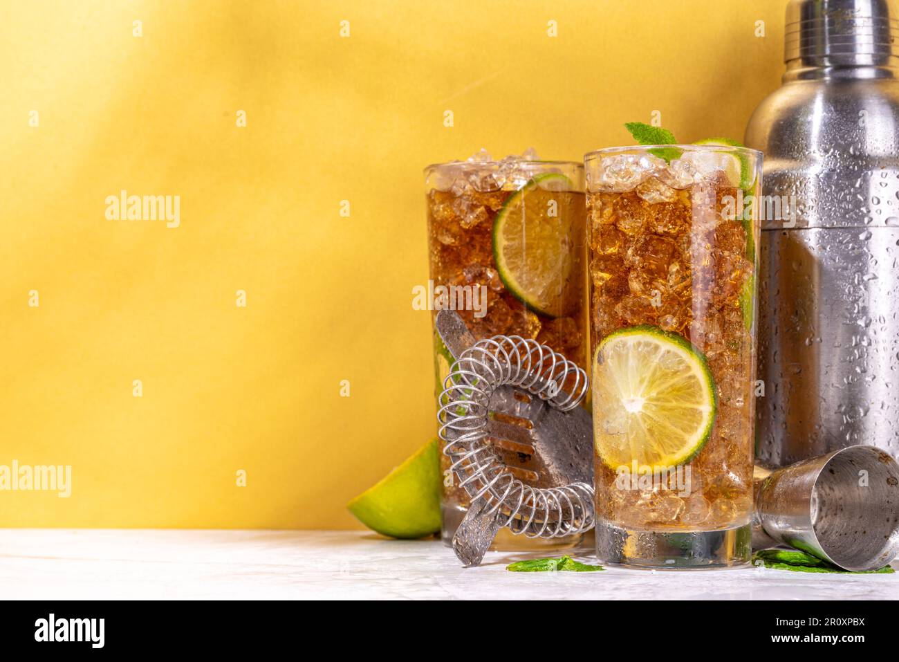 Cuba libre or long island summer cocktail, iced cola with lime and mint ...