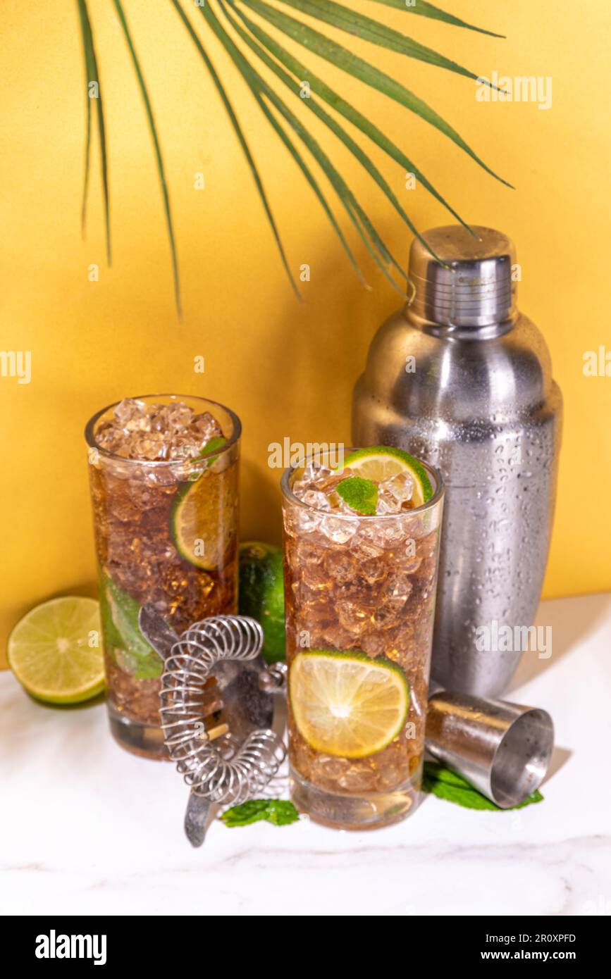 Cuba libre or long island summer cocktail, iced cola with lime and mint ...