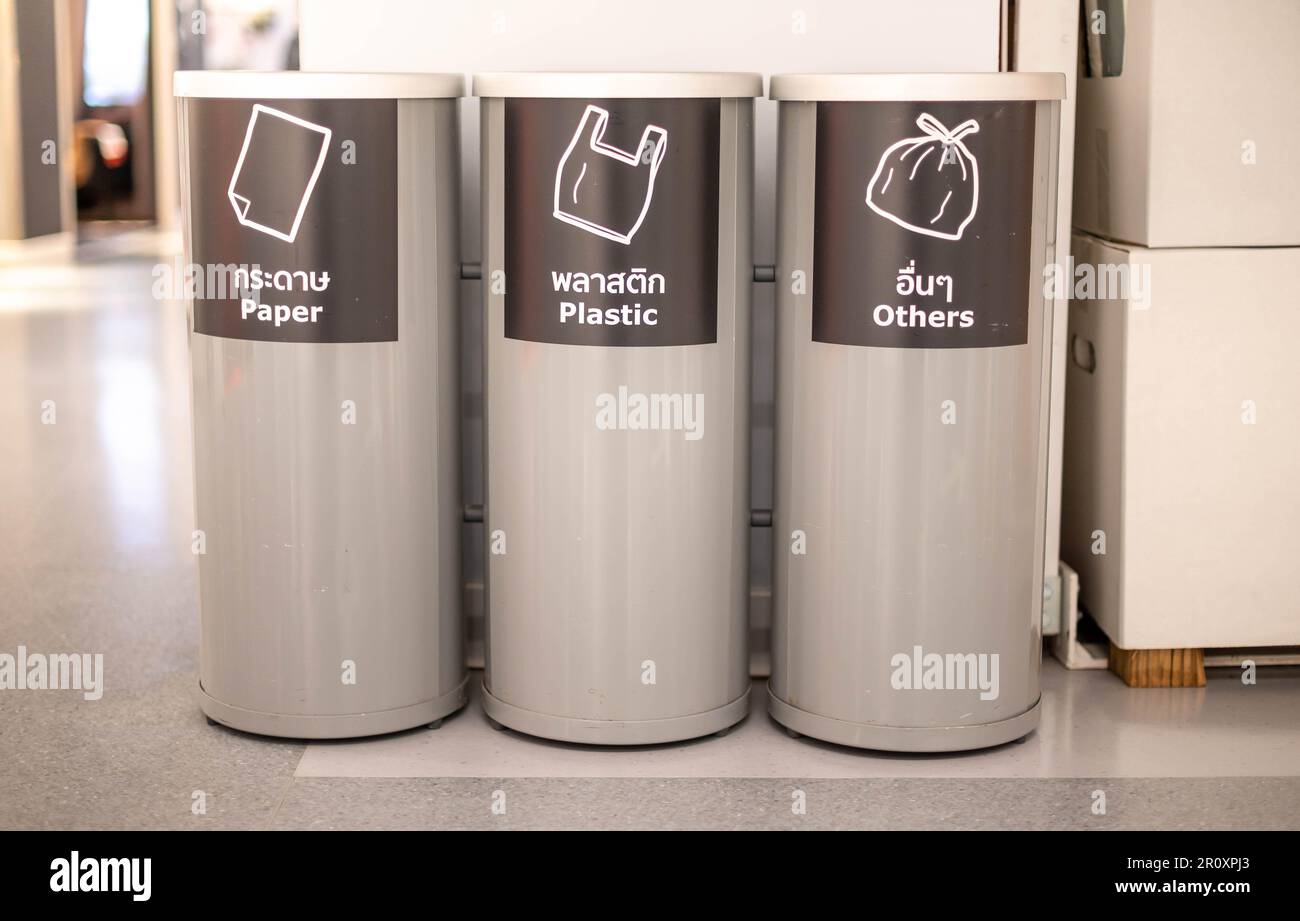 Modern metal cylinder trashcans or bins which separate the type of ...