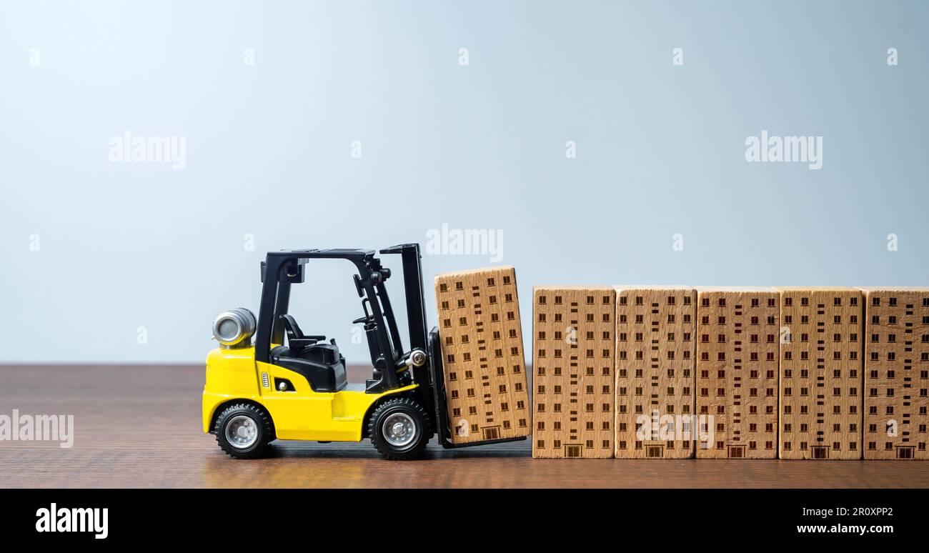 Forklift builds apartment residential buildings. Construction industry ...