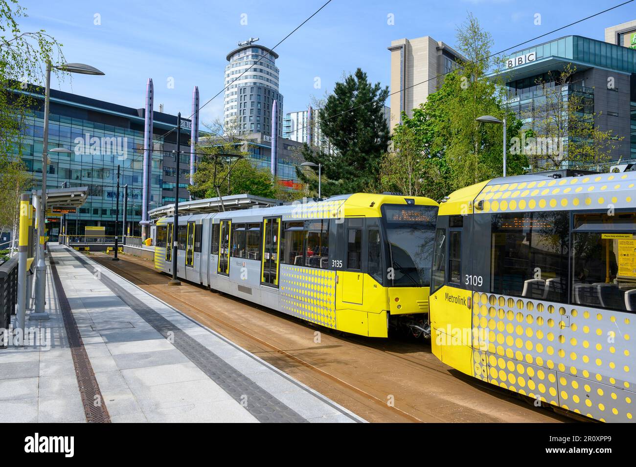 Manchester Metrolink tram waiting at a tram stop in Greater Manchester ...