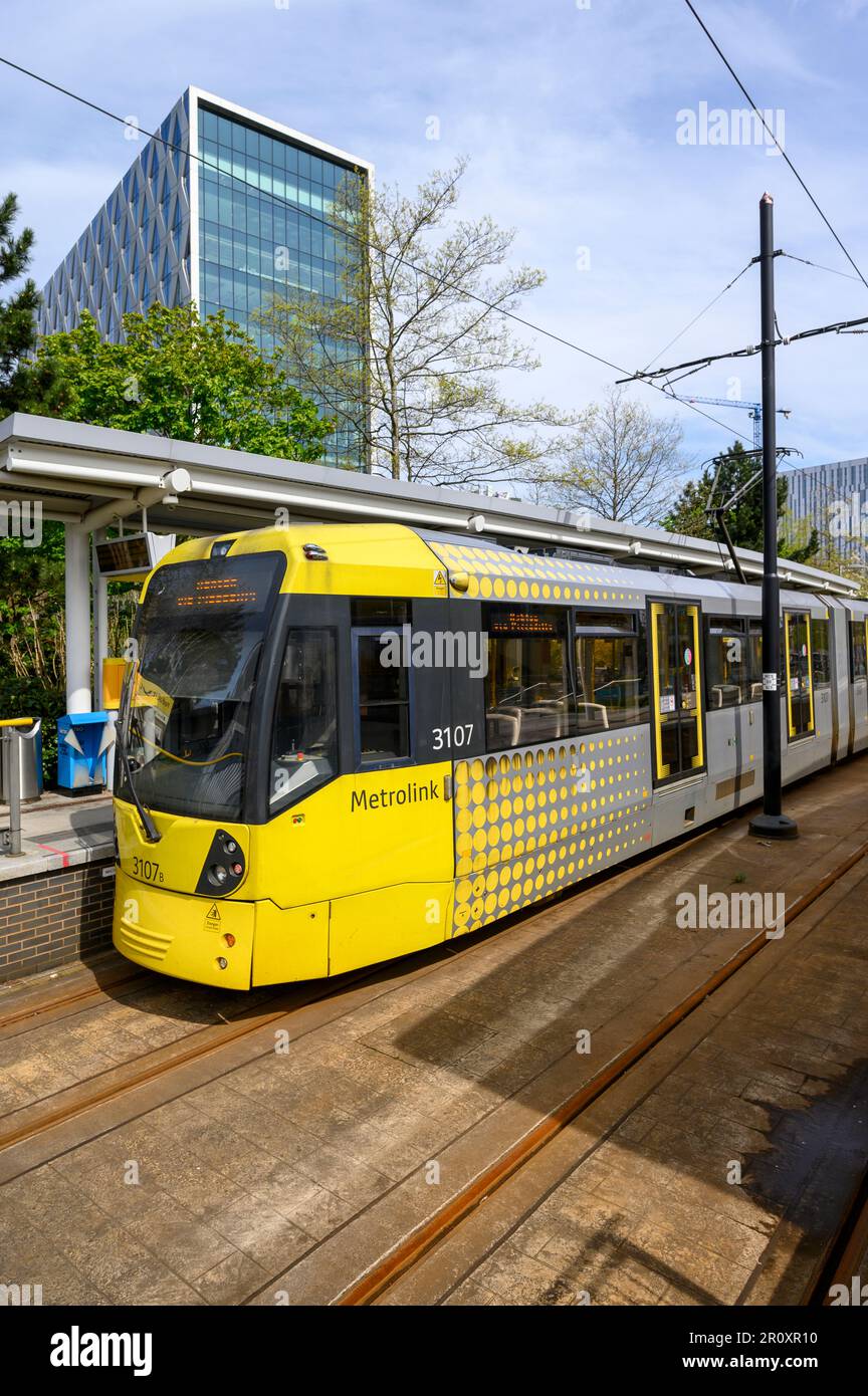 Manchester Metrolink tram waiting at a tram stop in Greater Manchester ...