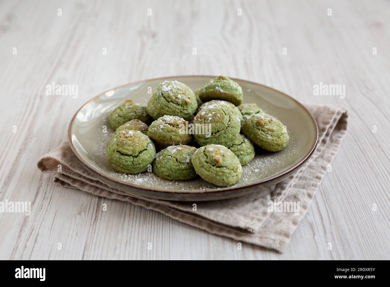 Homemade Soft Amaretti Cookies with Pistachio on a Plate, side view ...
