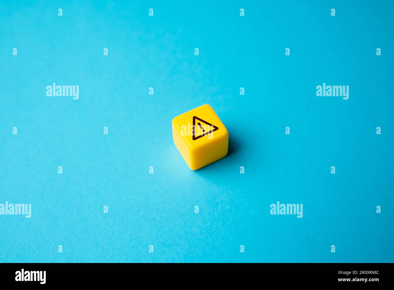 Warning sign on yellow block. Stress, problems. Something wrong. Danger ...