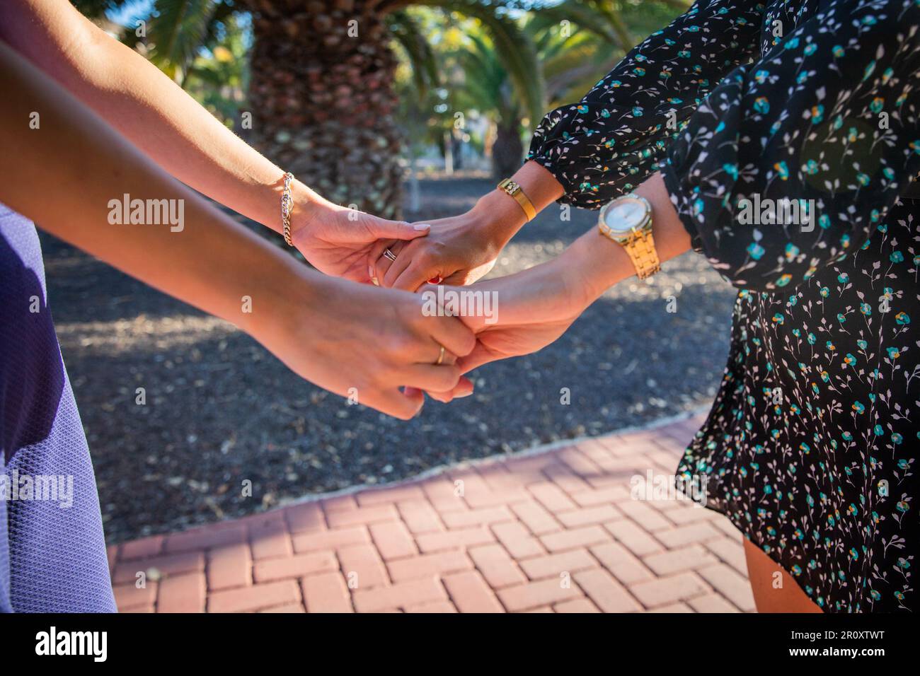 Two Girls In Love Holding Hands