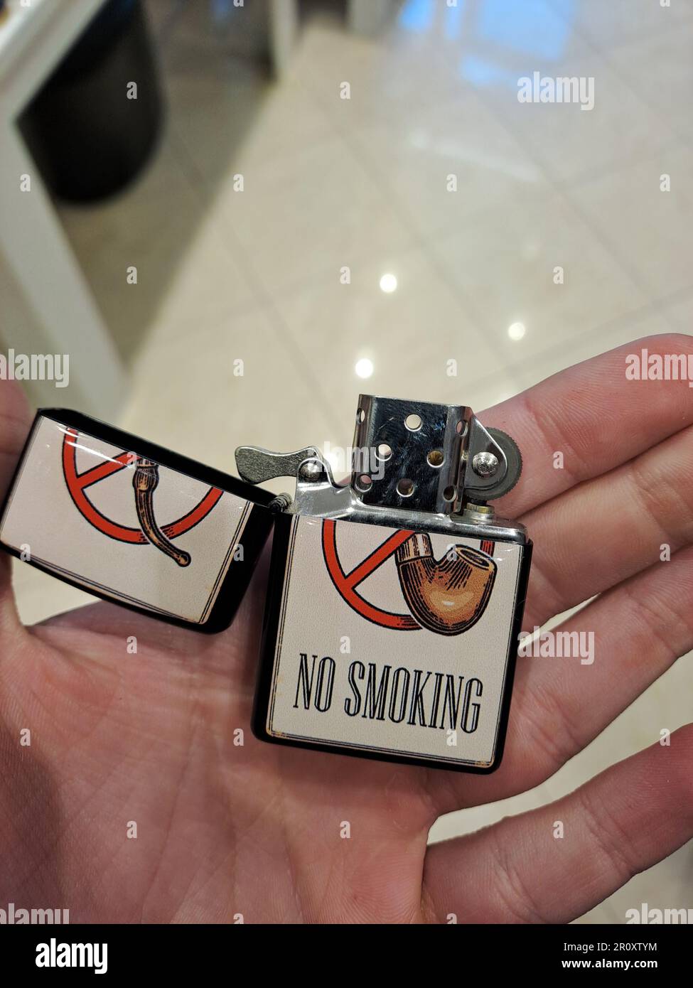 A no smoking sign is illustrated with two lighters Stock Photo - Alamy