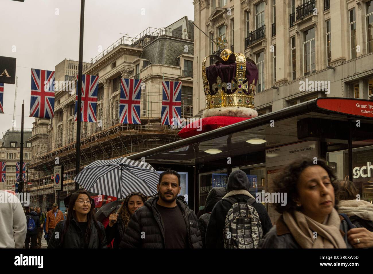 The people walking on a street in London with British flags for the ...