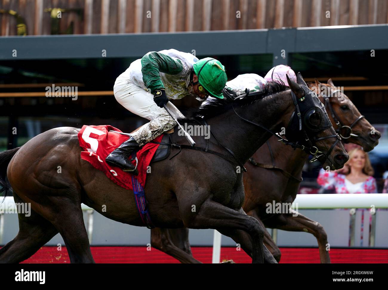 Danger Alert ridden by jockey William Buick (green cap) on their way to ...