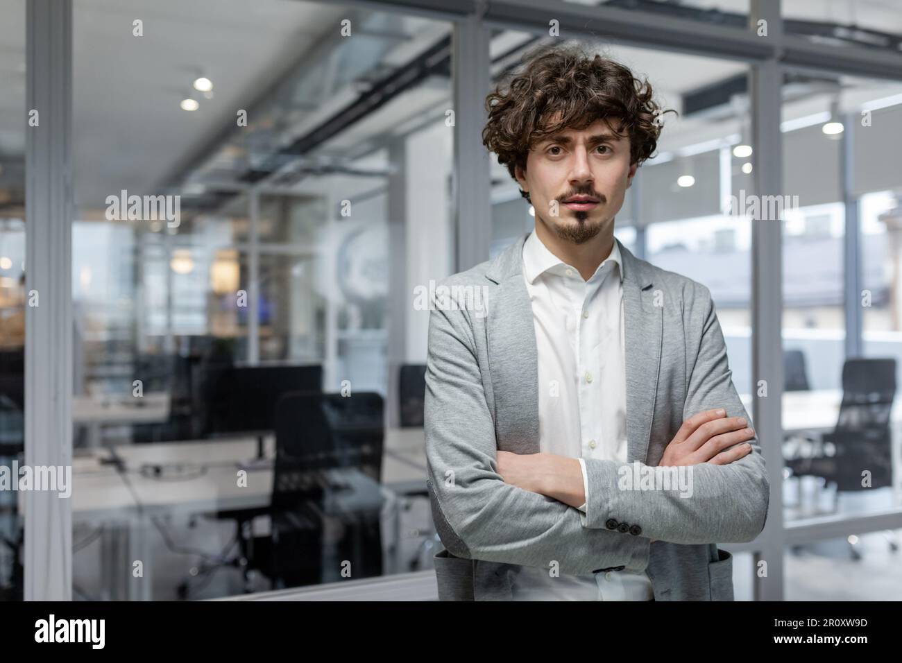 Portrait of hispanic businessman inside modern office, boss serious ...