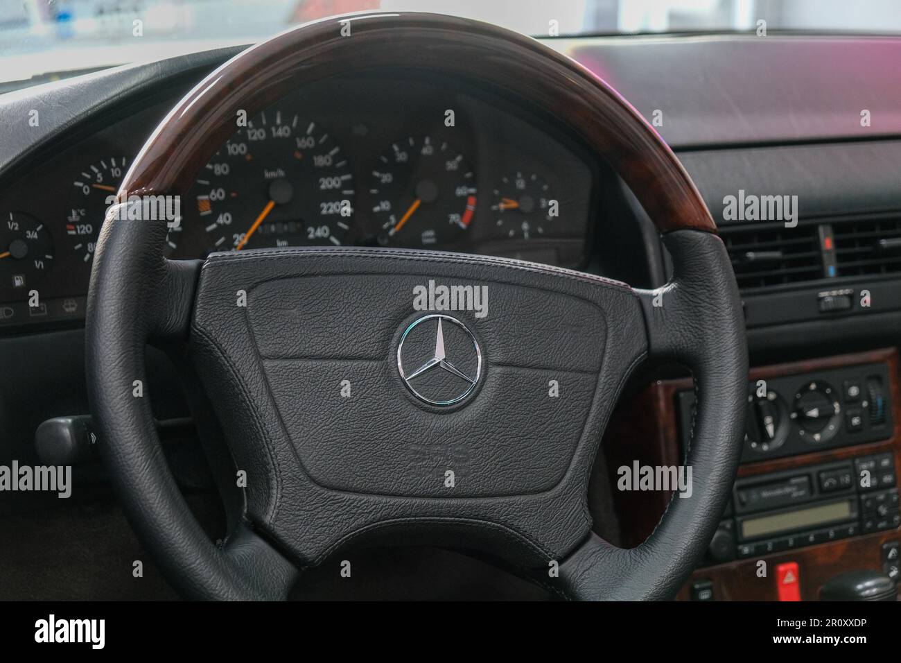 Close up Mercedes logo wheel with interior of old Mercedes display ...