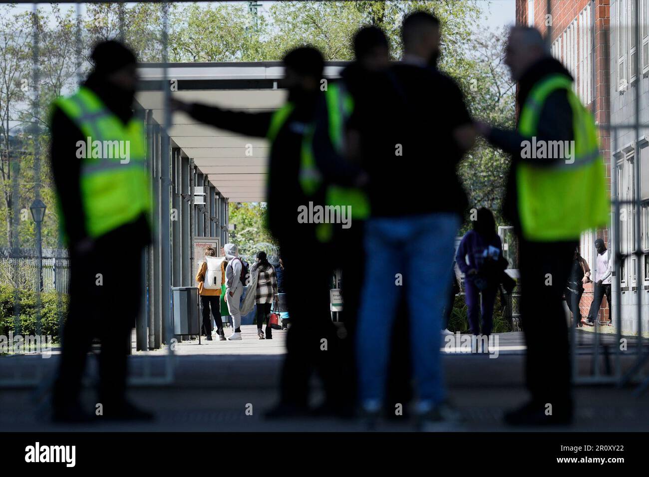 People enter the Immigration Office in the city of Berlin, Germany ...