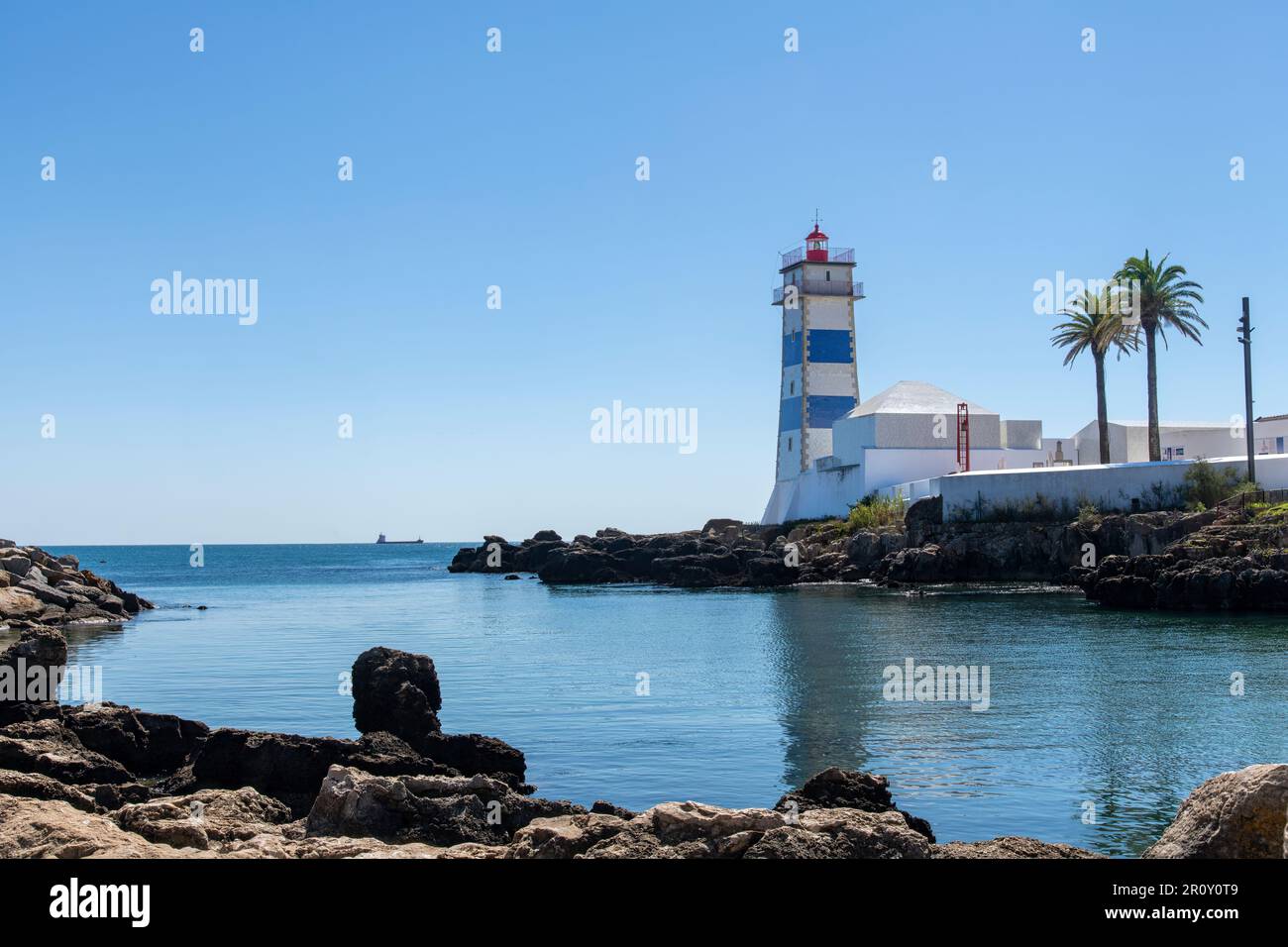 View over water of Cascais Bay in front of Santa Marta Lighthouse with ...