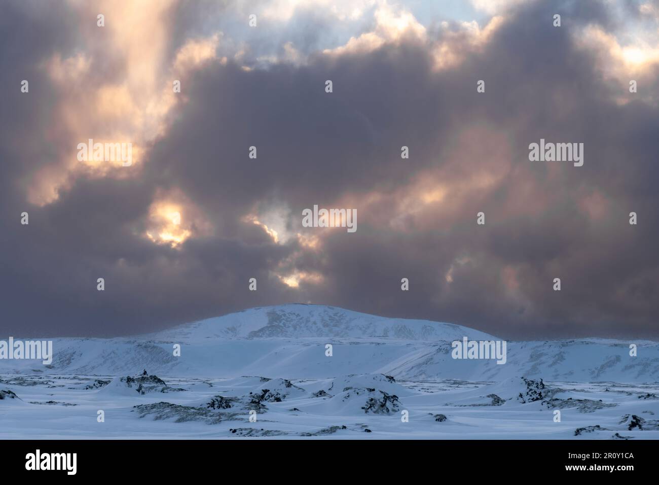 Panoramic view over a snowy landscape of lava, rocks and mountains in ...