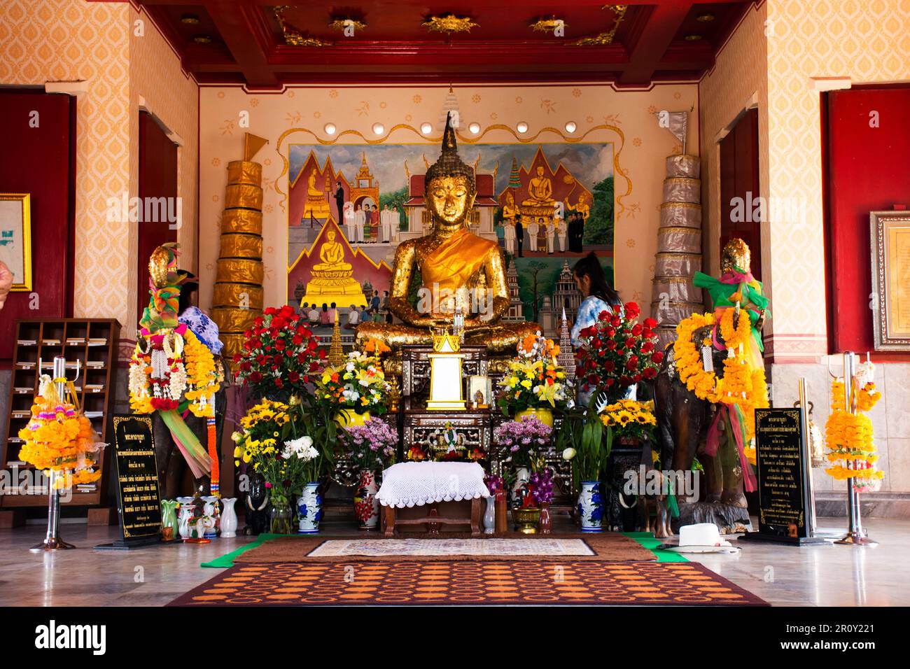 Ancient buddha statue and deity angel in small shrine for thai people ...