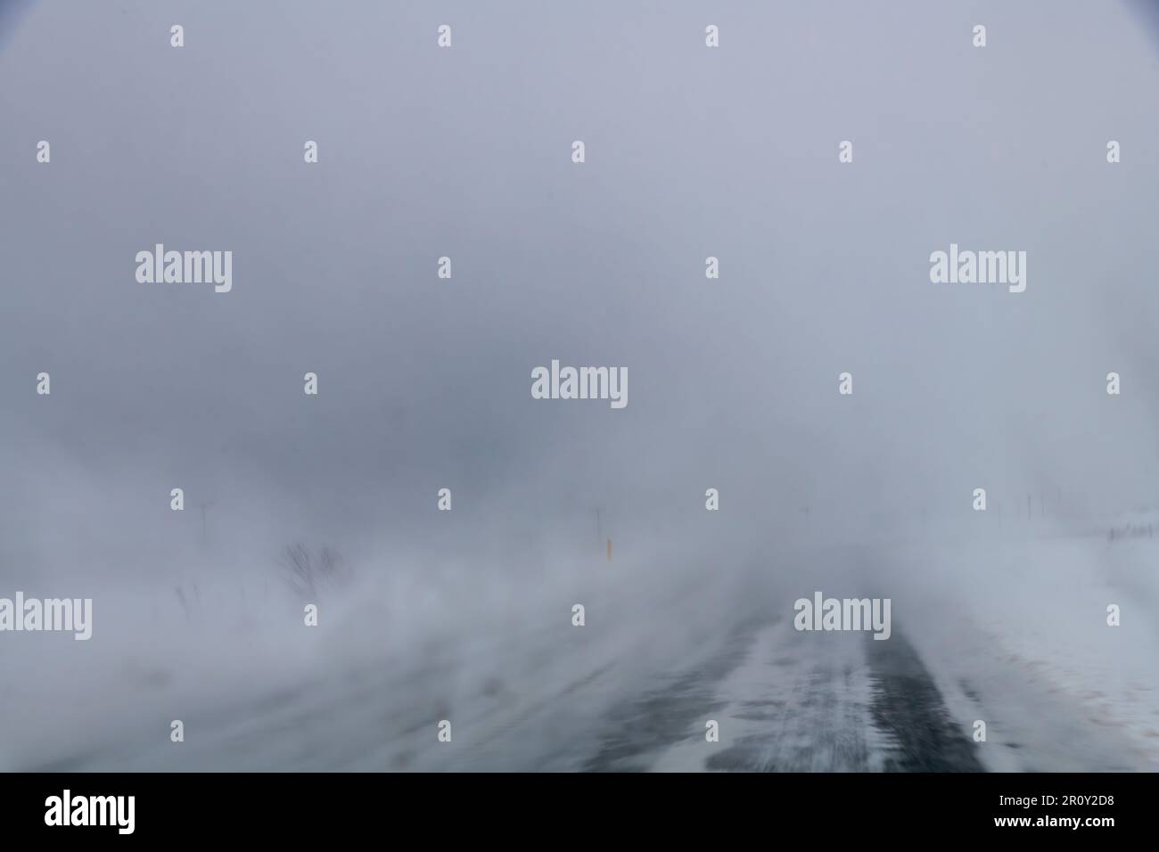 Driver’s perspective through the front windshield during a snowstorm ...