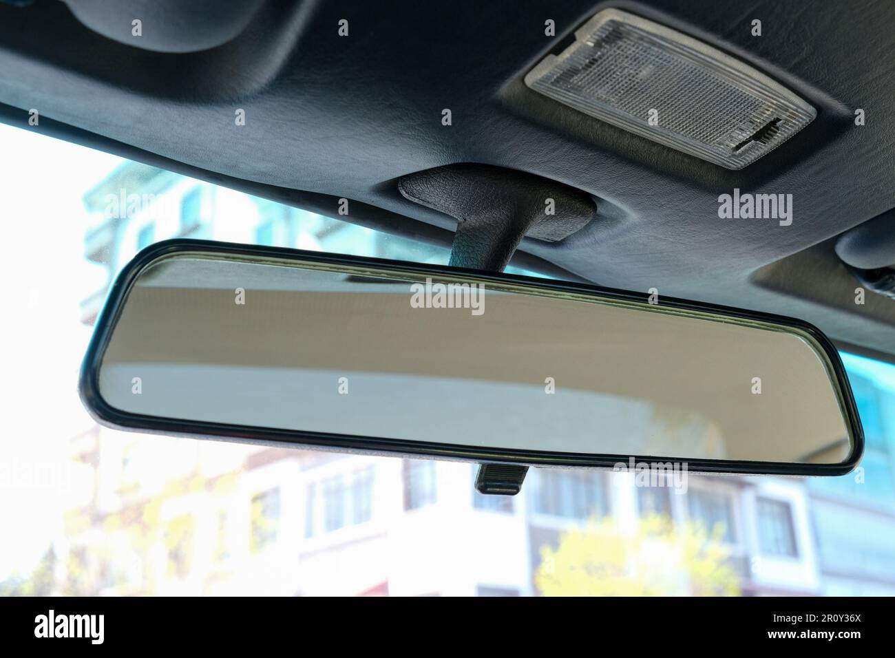 Close up old classic style rear view mirror inside of car. Mirror in ...
