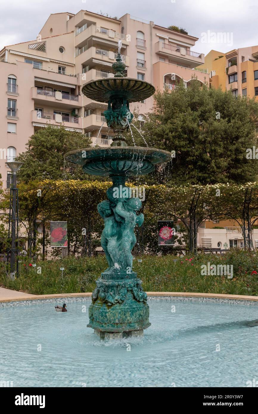 Fontvieille, Monaco, April 21st 2023:- A fountain with apartments ...