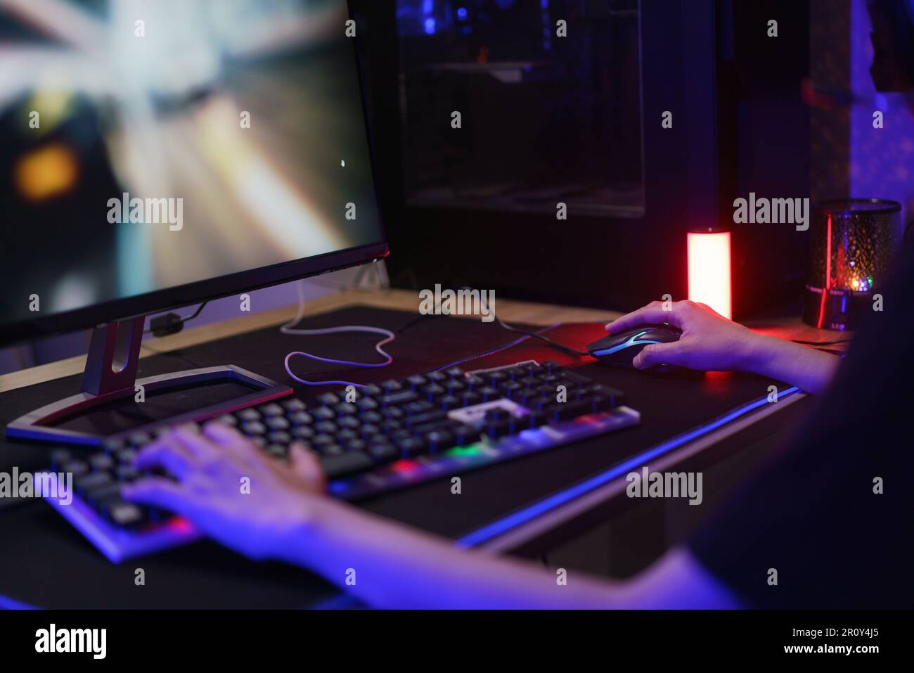 Hand of female cyber hacker gamer on keyboard to playing games or ...