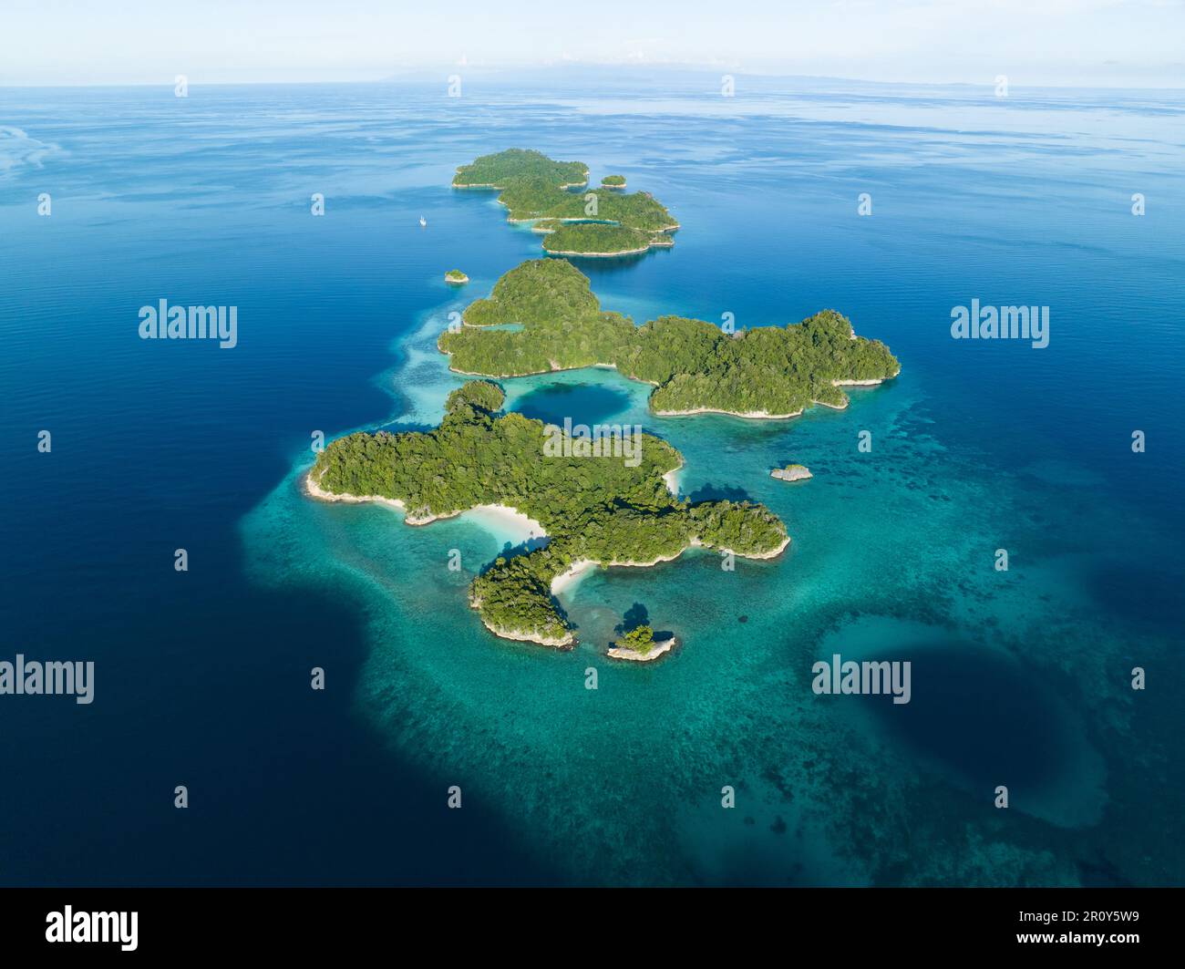 Healthy fringing coral reefs grow around the beautiful islands that ...