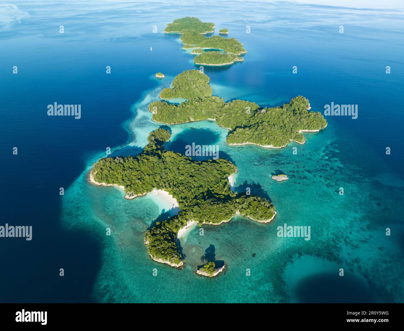 Healthy fringing coral reefs grow around the beautiful islands that ...
