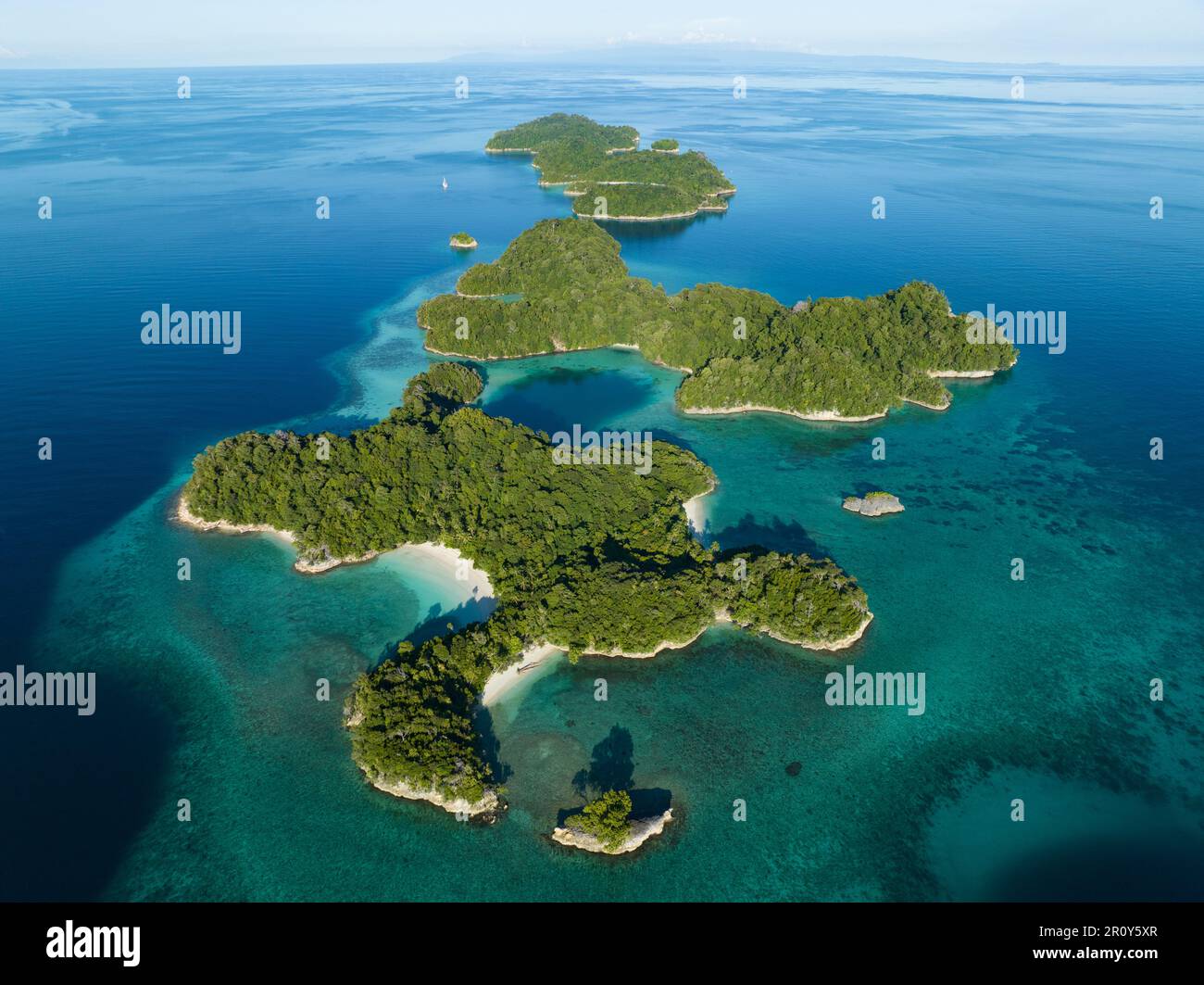 Healthy fringing coral reefs grow around the beautiful islands that ...