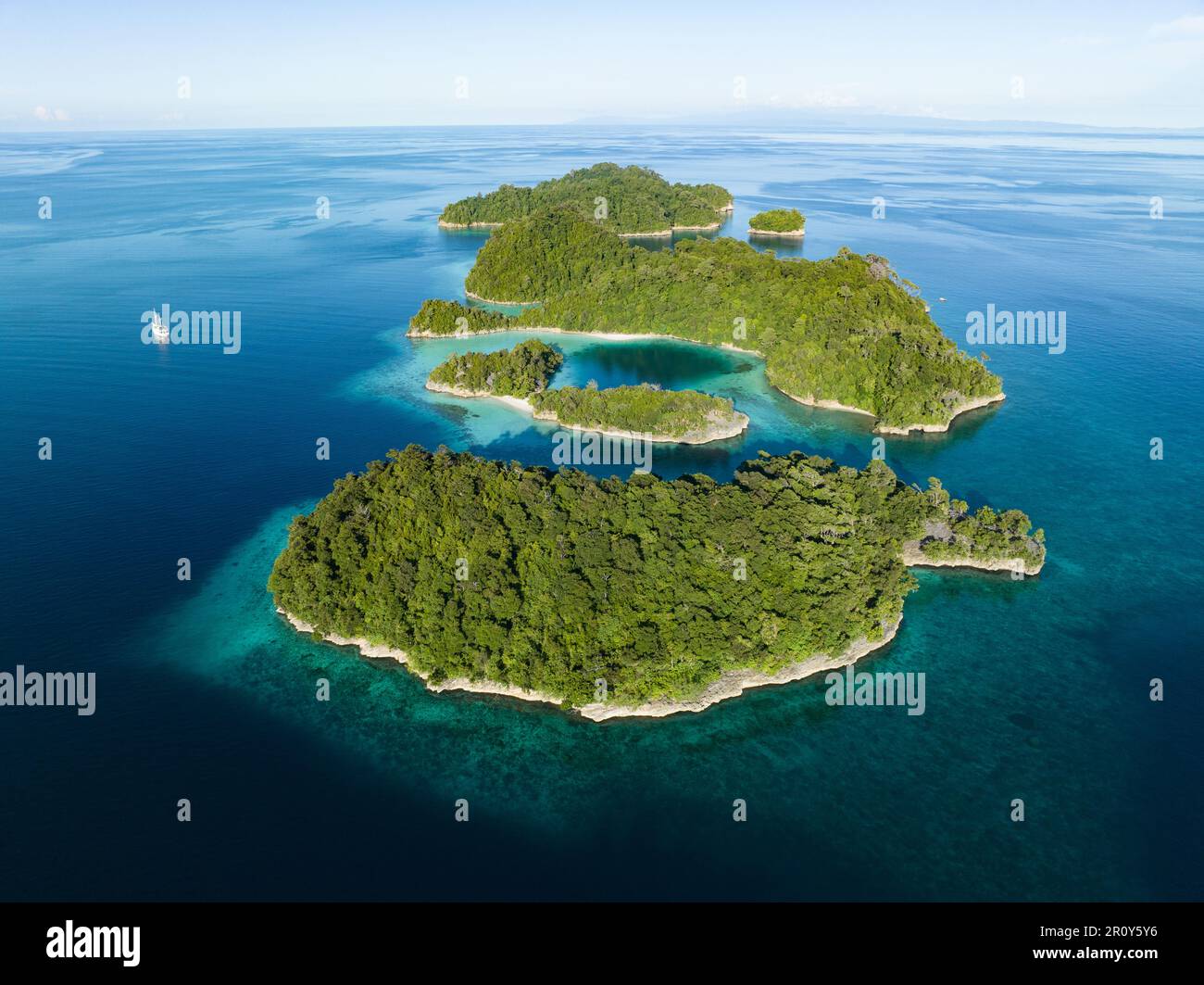 Healthy fringing coral reefs grow around the beautiful islands that ...