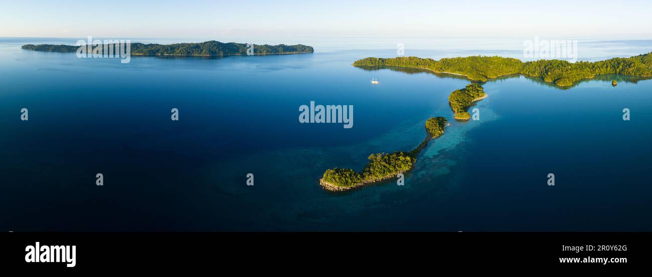 Healthy fringing coral reefs grow around the beautiful islands that ...