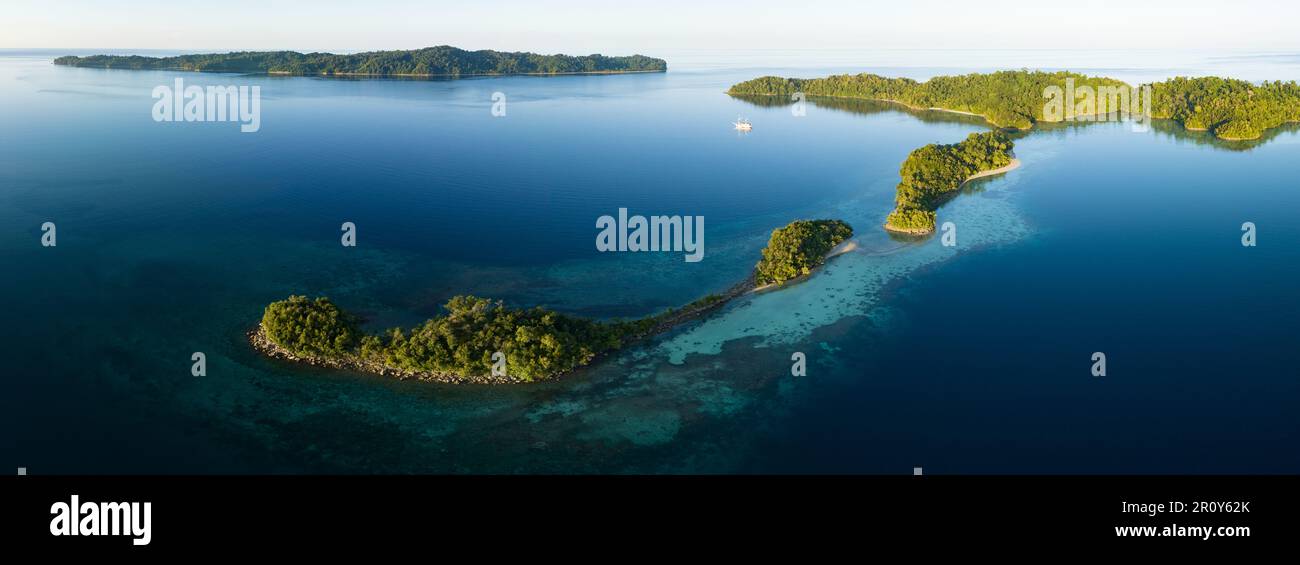 Healthy fringing coral reefs grow around the beautiful islands that ...