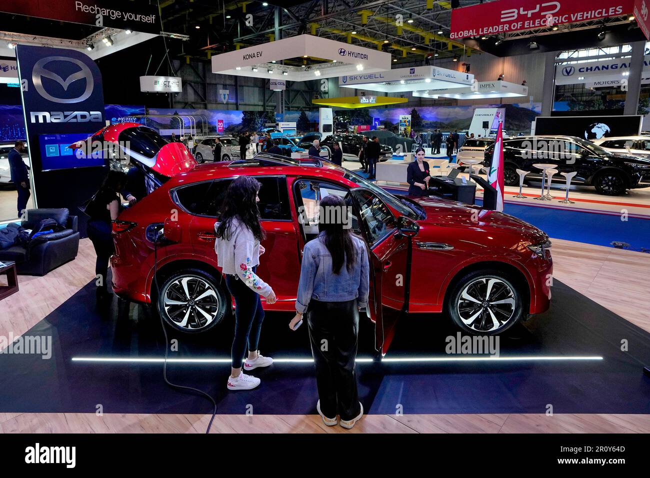 Visitors took at the new electric Mazda CX-60 car which display at the ...