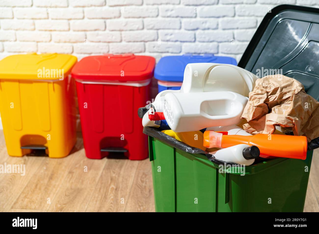 Trash cans full of waste in the building Stock Photo - Alamy