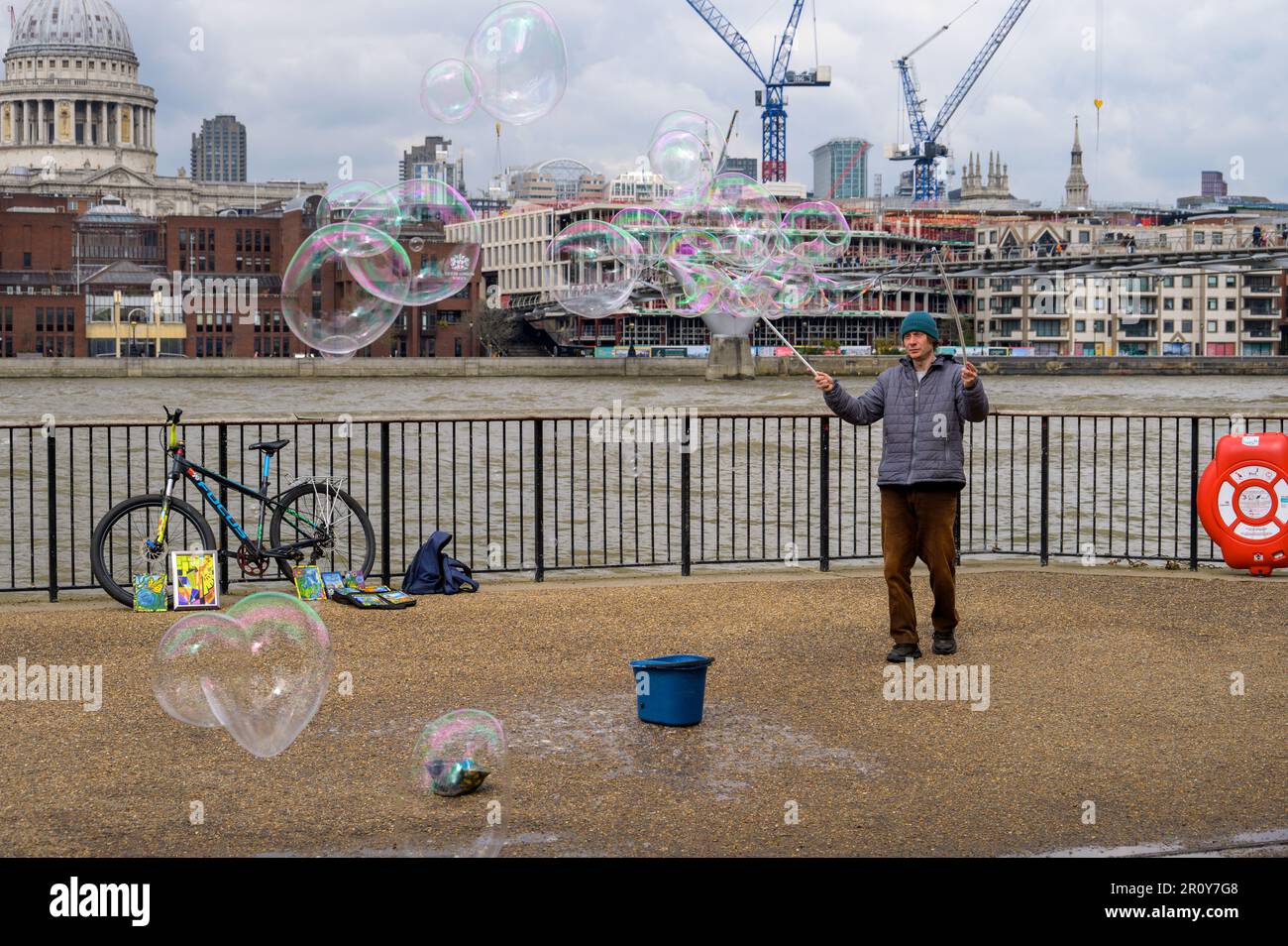 LONDON - April 21, 2023: Watch a street performer create magical ...