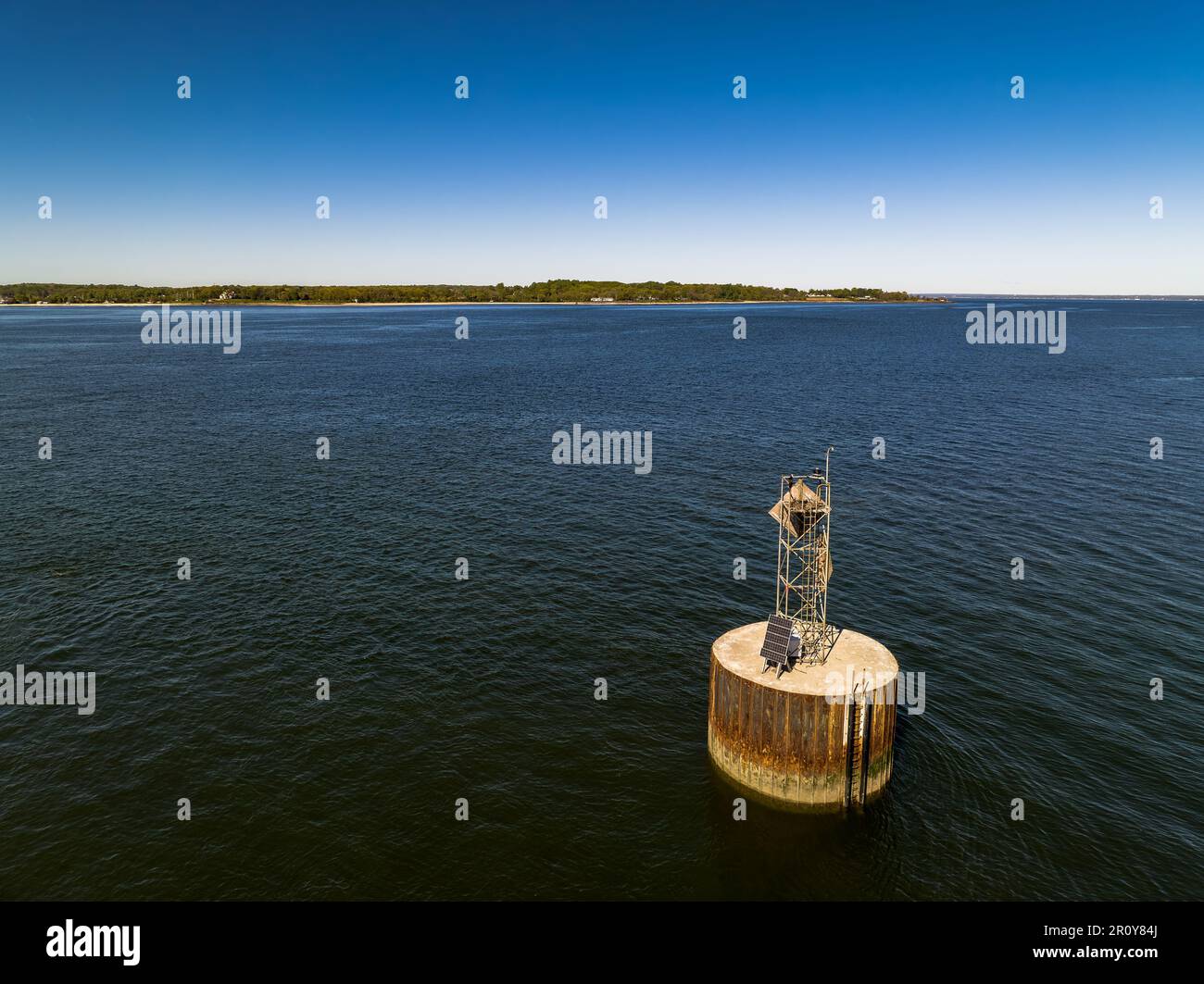 An aerial view of a circular concrete base with a solar-powered beacon ...