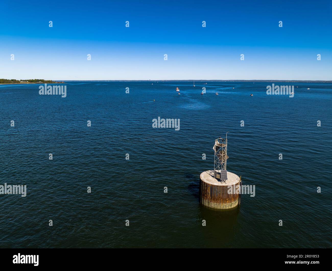 An aerial view of a circular concrete base with a solar-powered beacon ...