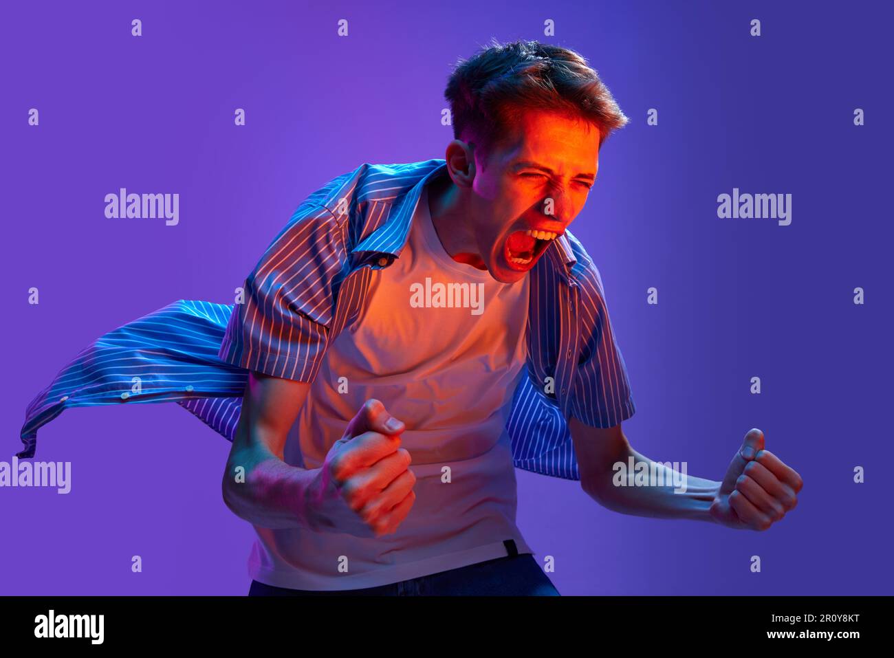 Portrait of young emotive man guy in casual clothes showing success and ...