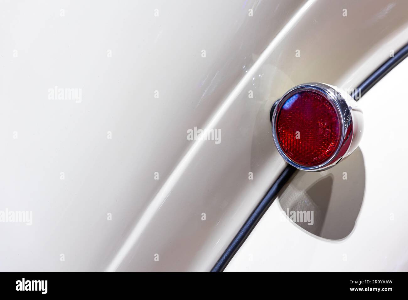 Close-up of the tale lights of a white classic car. Beautifully ...