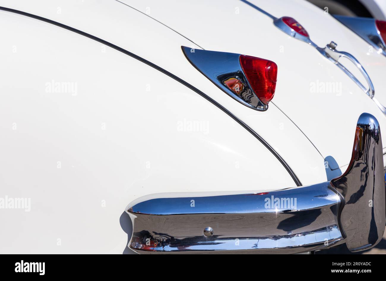 Close-up of the tale lights of a white classic car. Beautifully ...