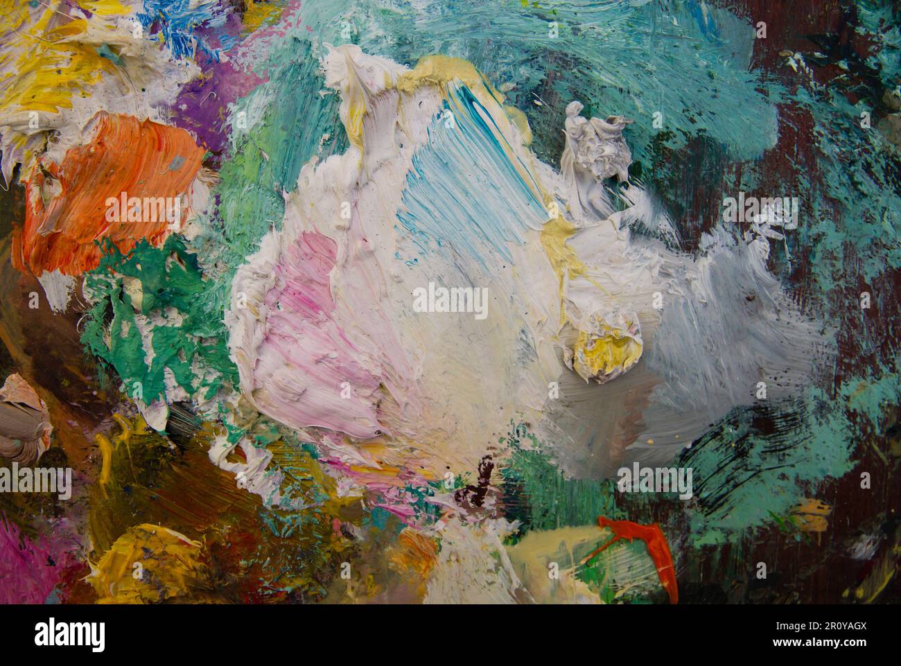 Detail of mixed colours in an paint palette Stock Photo - Alamy