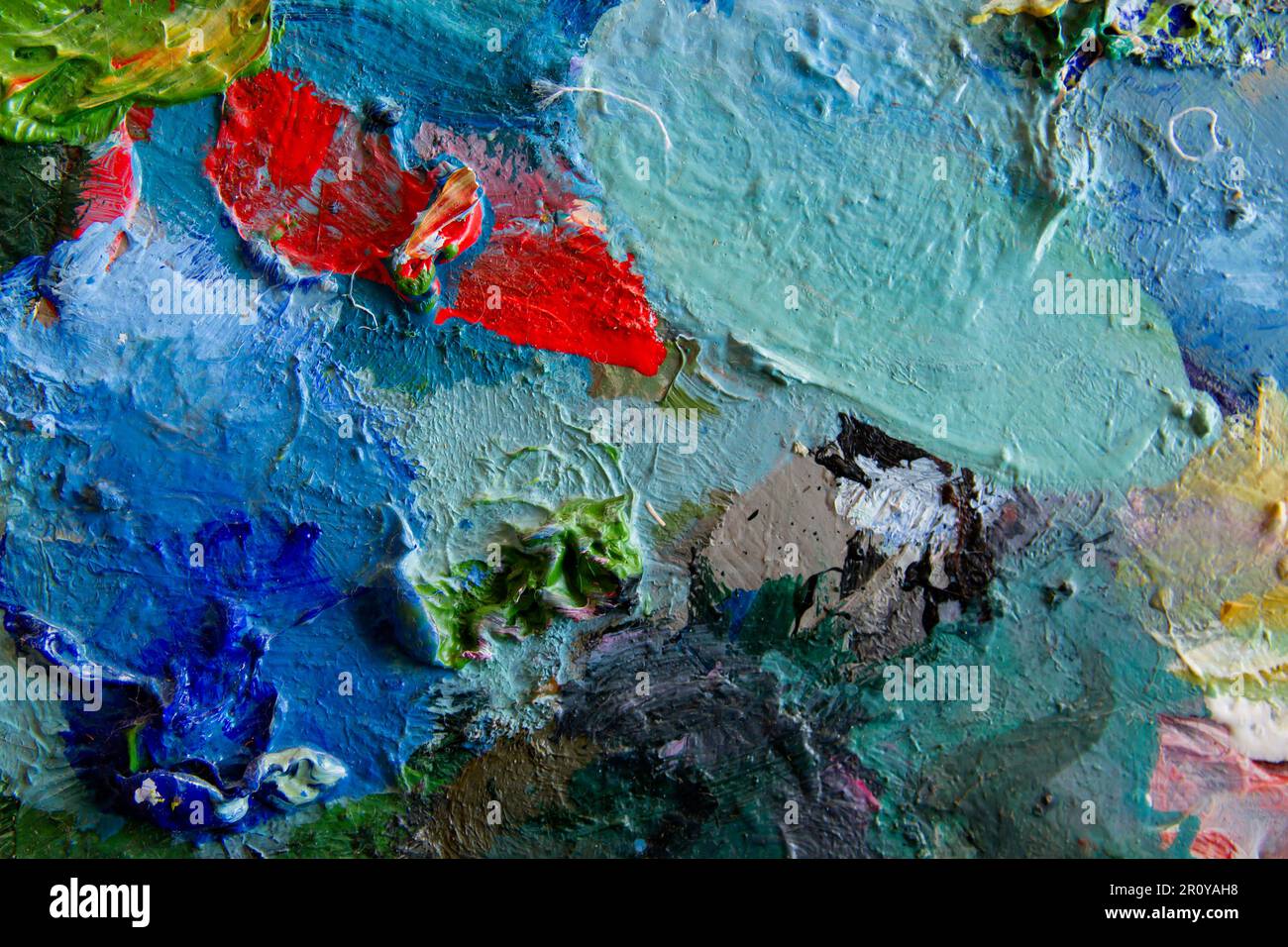 Detail of mixed colours in an paint palette Stock Photo - Alamy