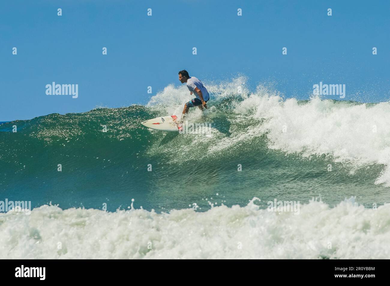 Shortboard surfer on the crest of a wave at this fast-growing surf ...
