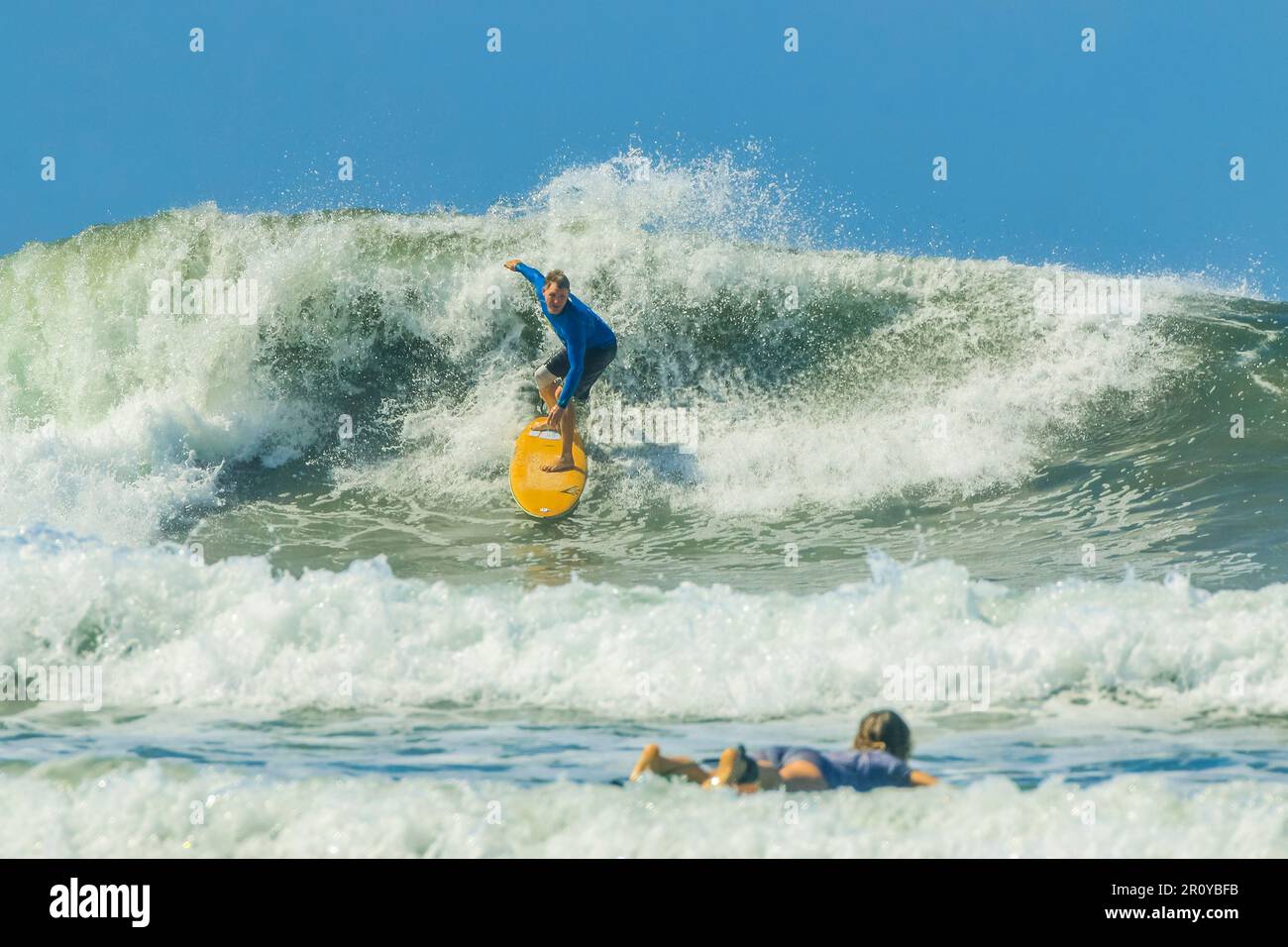 Shortboard surfer on the crest of a wave at this fast-growing surf ...