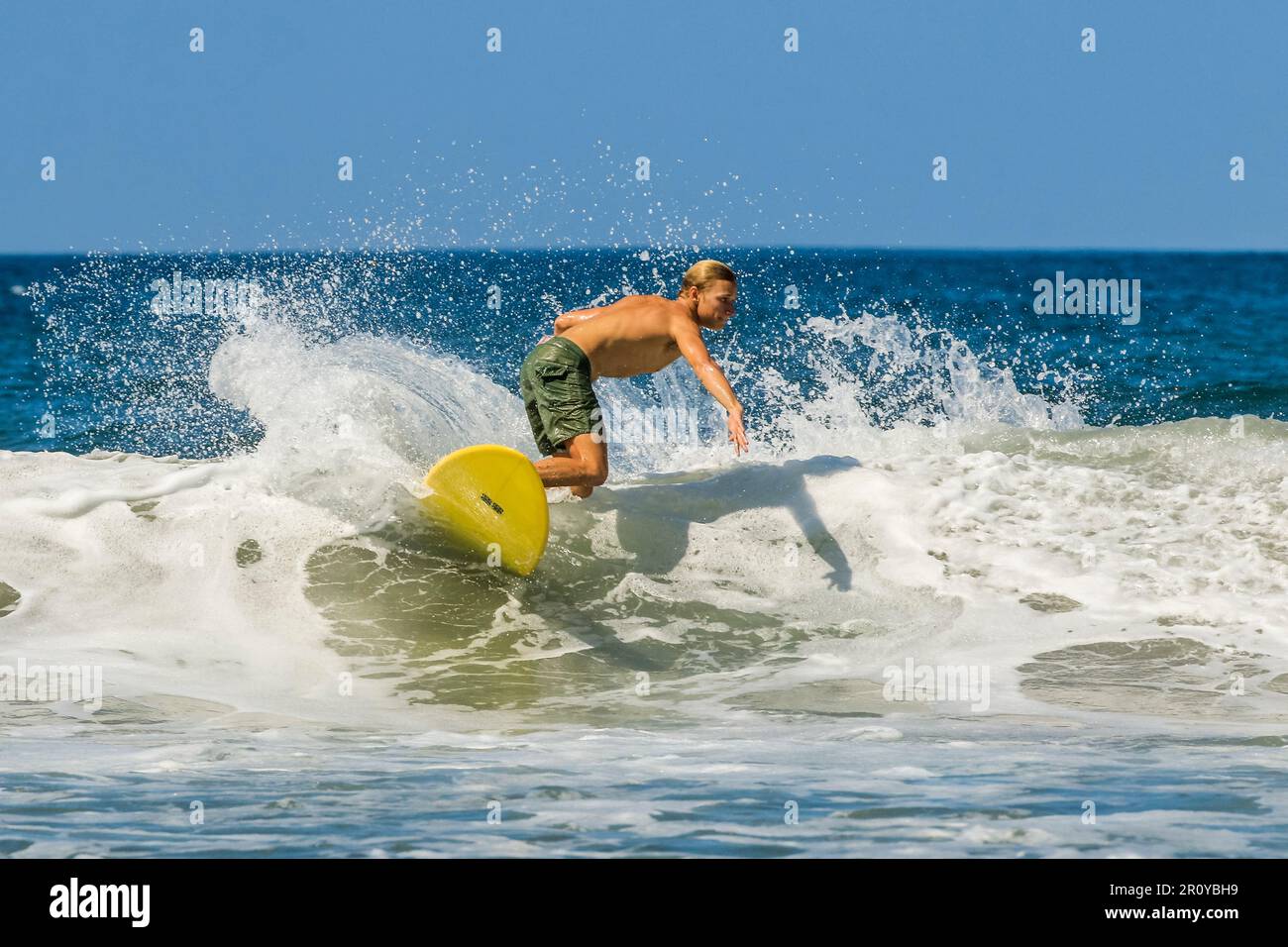 Shortboard surfer does a cutback turn on a wave at this fast-growing ...