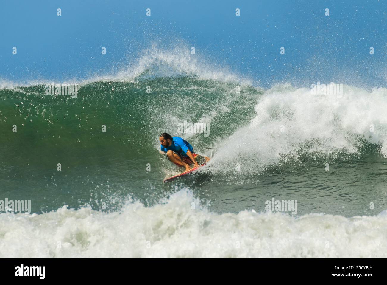 Surfer holds the rail of his shortboard on a wave at this fast-growing ...