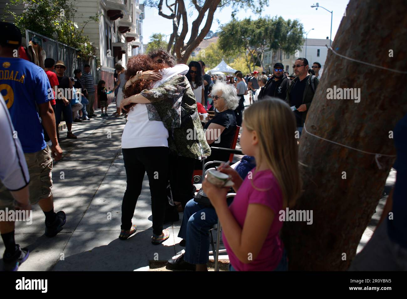 FINAL CAPTION TK Noe (tk) (l to r) and Maria Mosqueda hug on Folsom ...