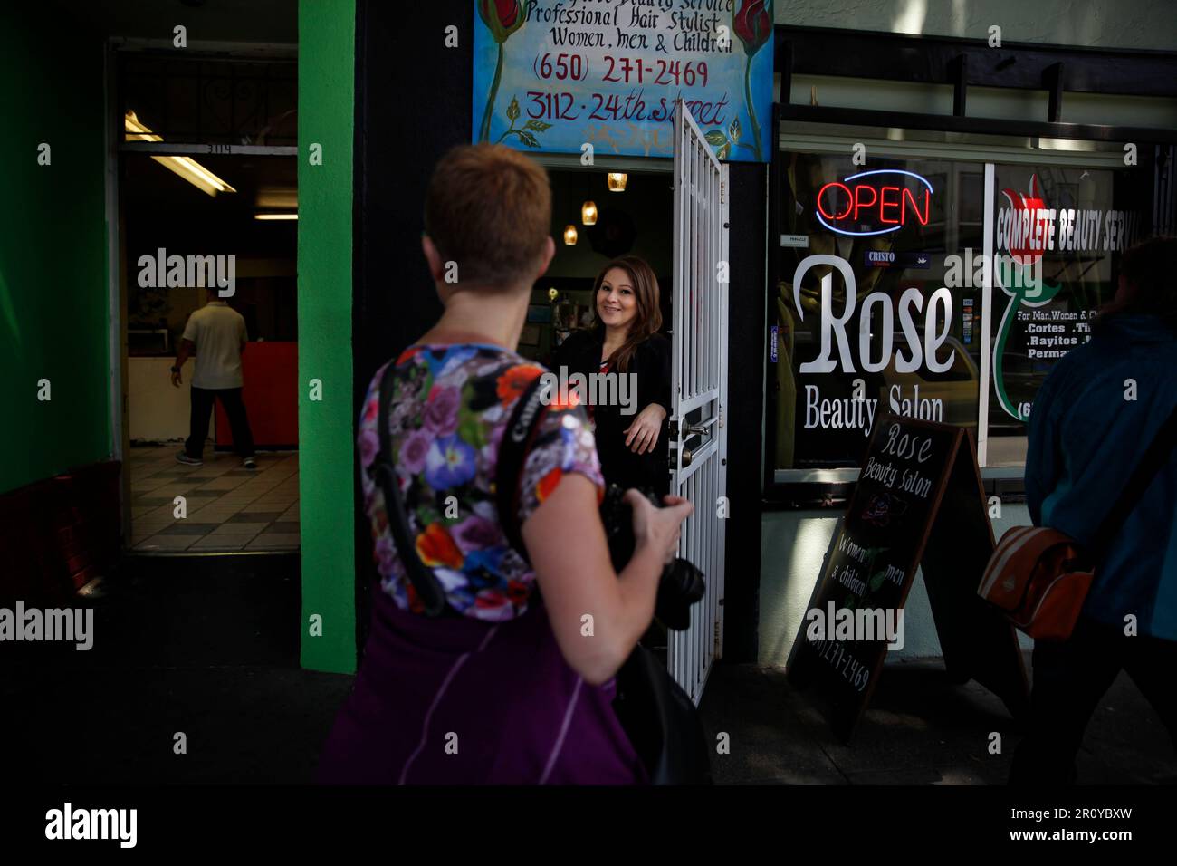 Rose Hunter smiles at passersby on 24th Street as she stand in the ...