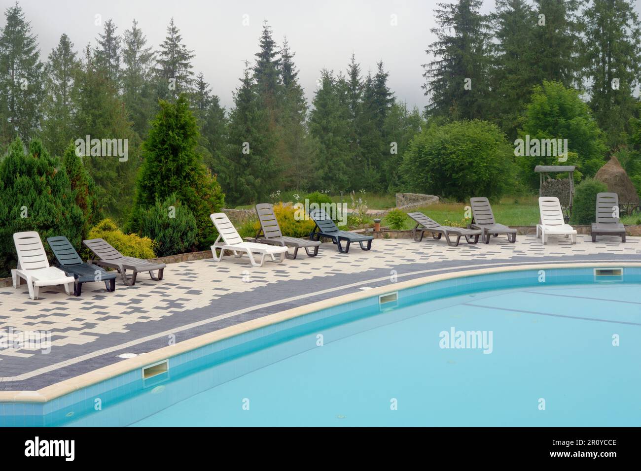 Outdoor swimming pool mountain hotel pool resort chair pool lounge ...