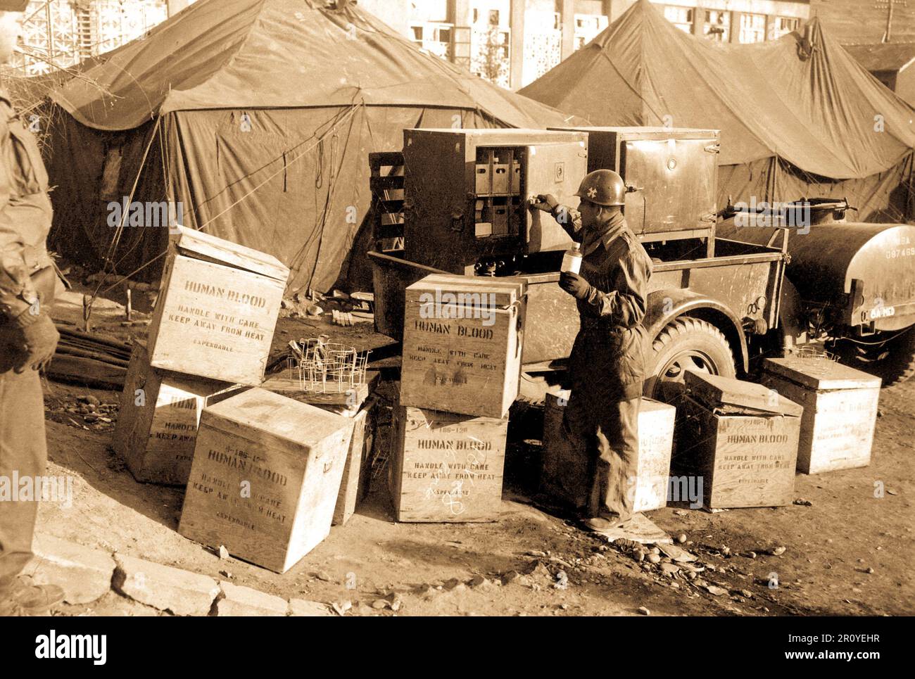 M/Sgt. George Miller selects human blood for patient at the 8076th ...