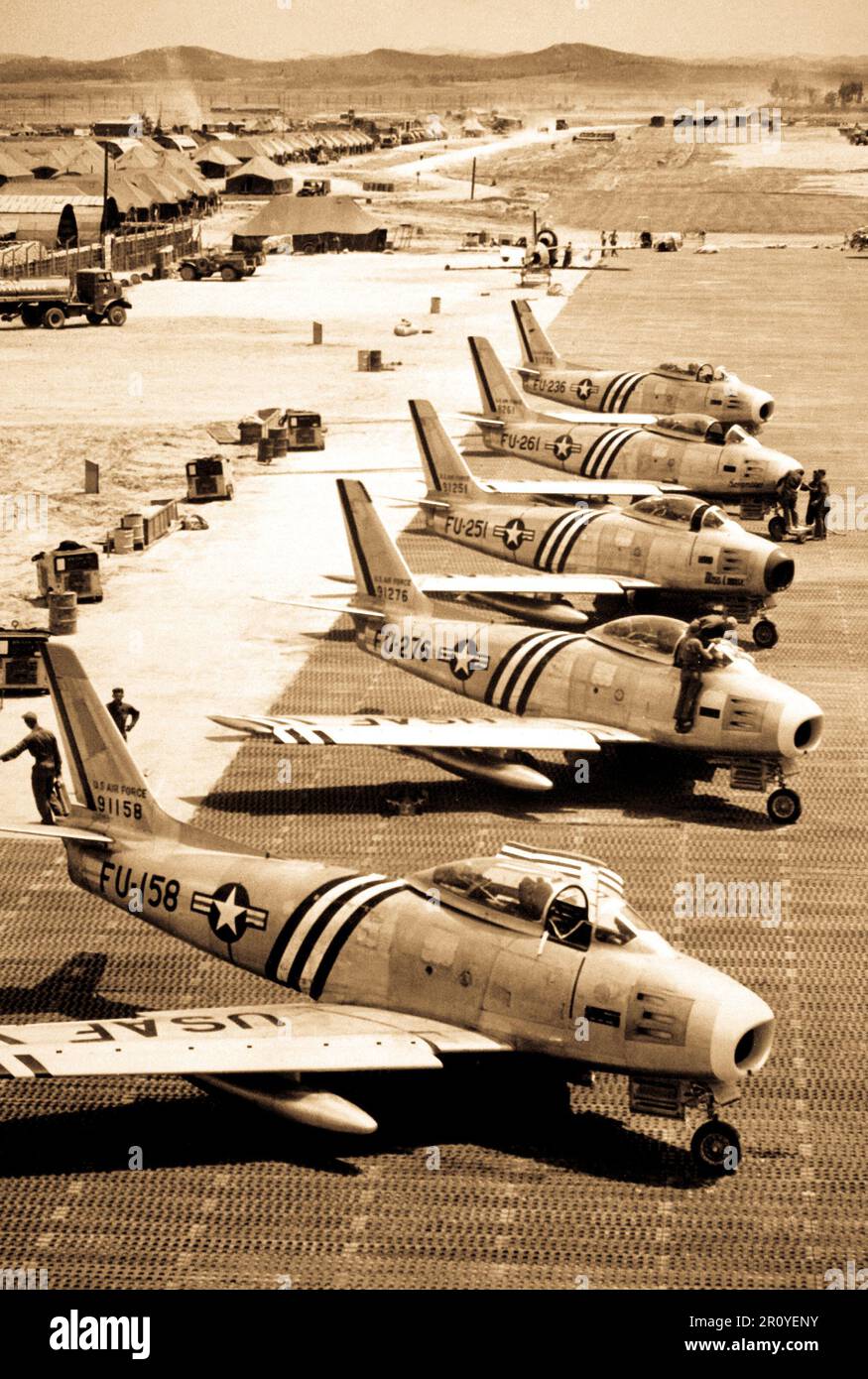 View of F-86 airplanes on the flight line getting ready for combat ...