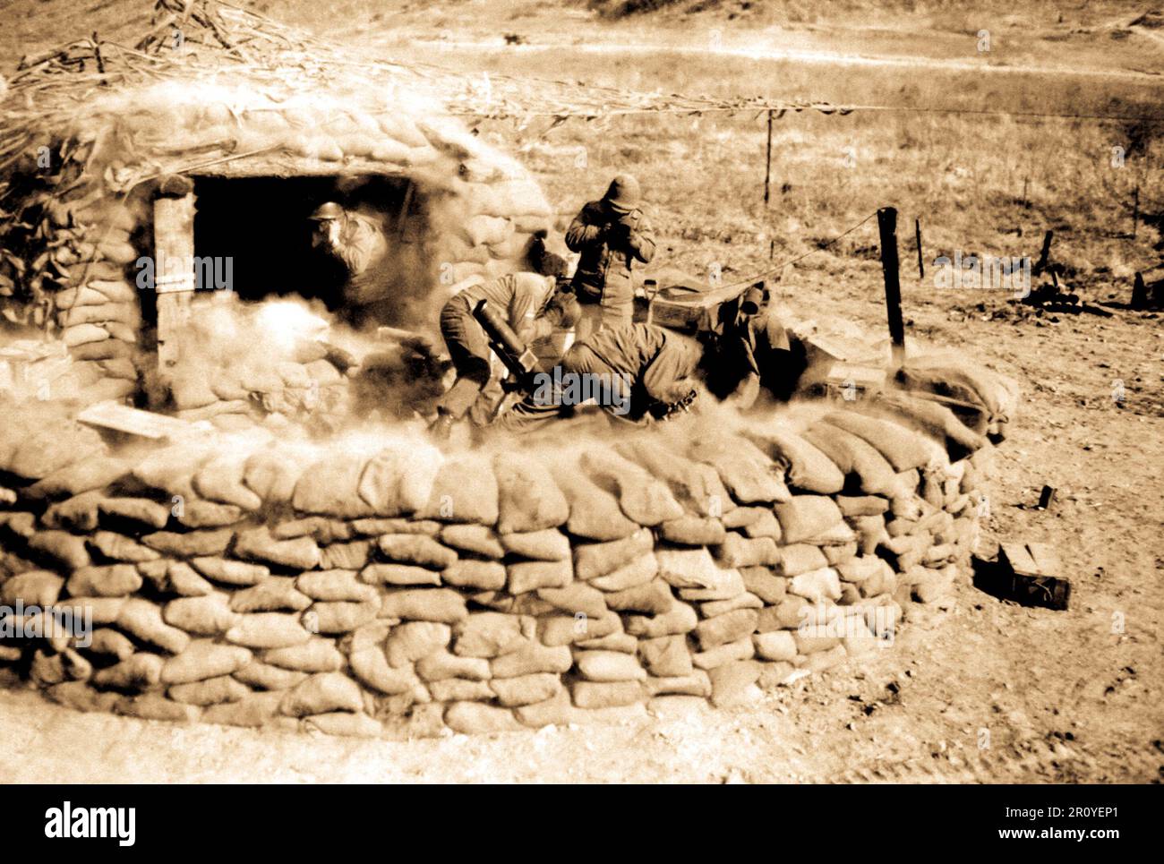 Men of the 4.2 mortar crew, 31st Heavy Mortar Co. fire at enemy ...